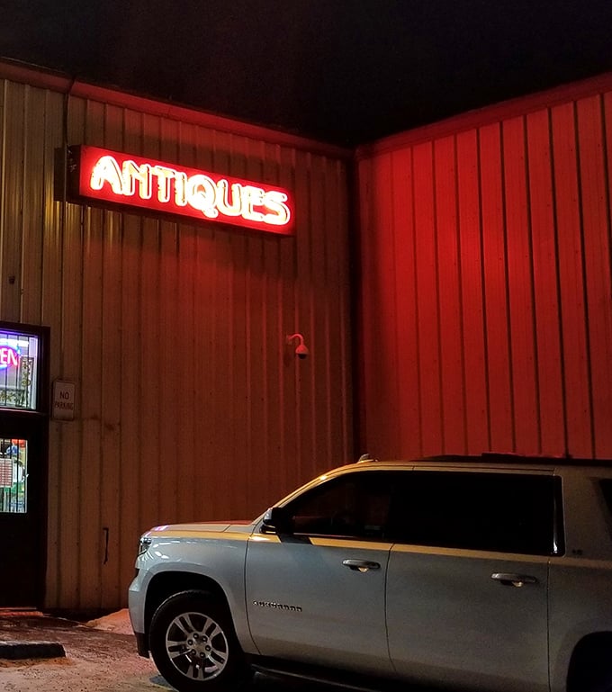 The neon glow against Alaska's early darkness creates a beacon for night owls hunting vintage treasures after sunset.