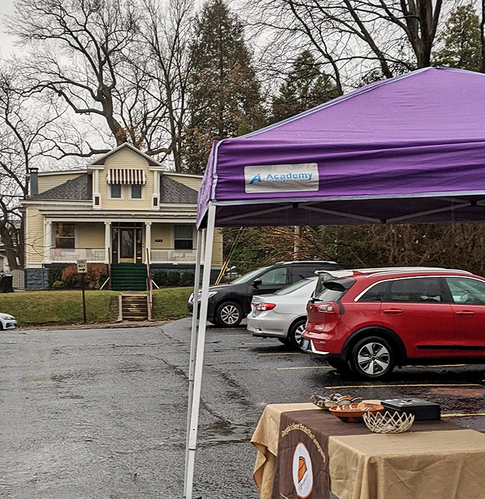 The market nestles into the neighborhood like it's always belonged there, a temporary village that appears like clockwork every Saturday morning.