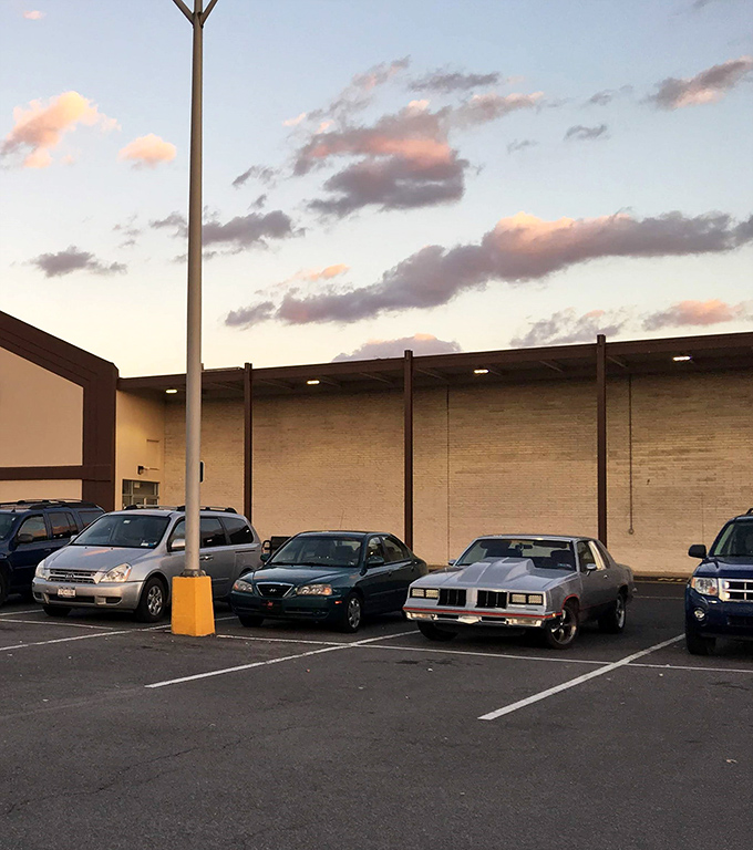 As dusk falls, cars still fill the lot. Thrift shopping isn't just an errand here—it's an experience worth extending into evening.