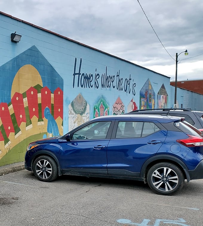 The colorful exterior mural transforms a simple warehouse into an inviting community landmark. Even your car looks happier parked here.