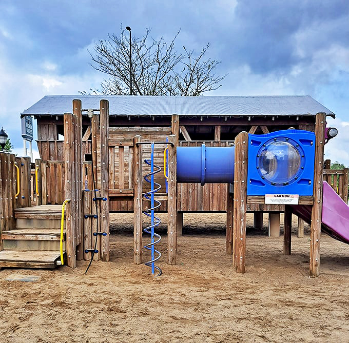 Even the little ones get a shopping break at this rustic playground, where slide adventures replace retail therapy.