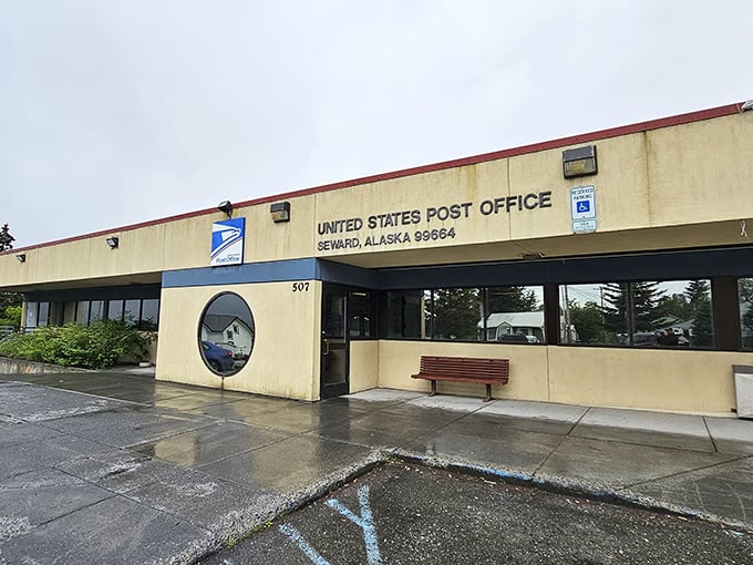 The post office where your "Wish you were here" postcards begin their journey, backed by mountains that make the Grand Canyon look like a sidewalk crack.