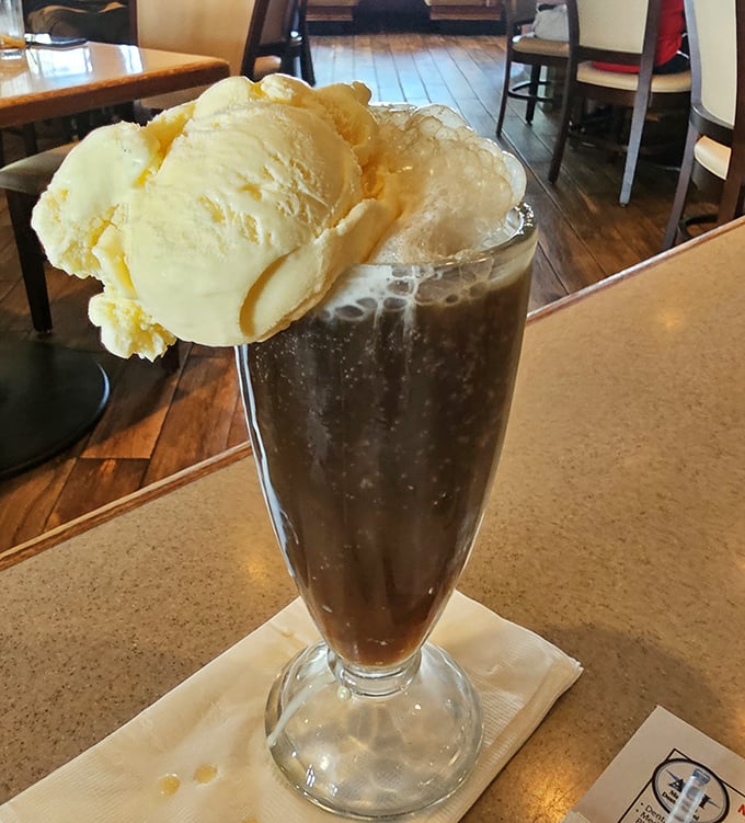 Root beer float that bridges childhood nostalgia and adult indulgence&mdash;ice cream melting into soda like memories melting into conversation.
