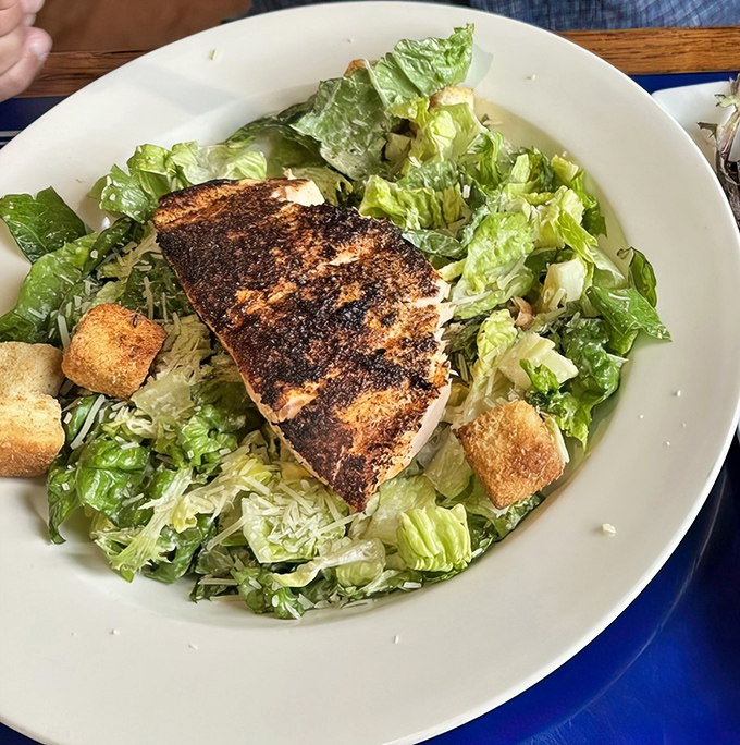 This blackened salmon Caesar isn't just a salad—it's what happens when the ocean and garden decide to throw a party together.