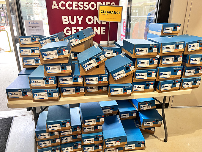 The "Buy One, Get One" table &ndash; where shoe boxes stack like a retail Jenga game waiting for the right shopper to make their move.