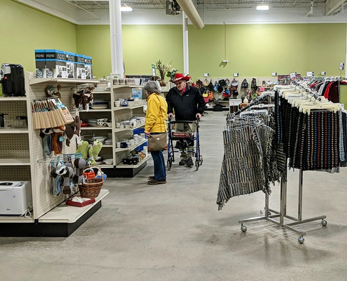 Serious thrifters in their natural habitat, navigating aisles with the focused determination of archaeologists on the verge of discovery.