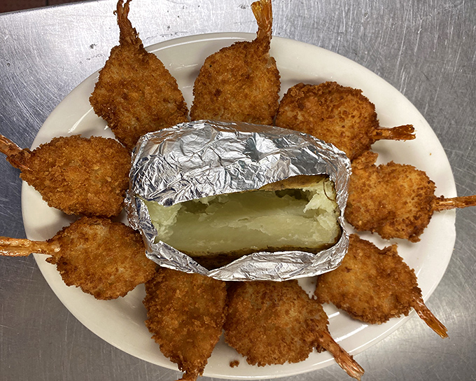 Shrimp pops arranged like a sunburst around a baked potato&mdash;seafood architecture that's too pretty to eat. Almost.