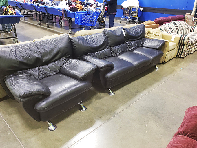Leather couches with stories to tell. That one on the left definitely witnessed some serious Netflix marathons in its previous life.
