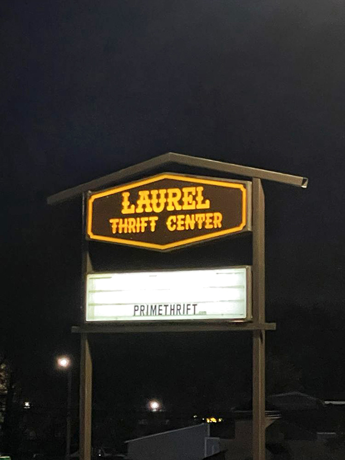 After dark, the illuminated sign stands as a lighthouse for night owls seeking last-minute thrifting adventures.