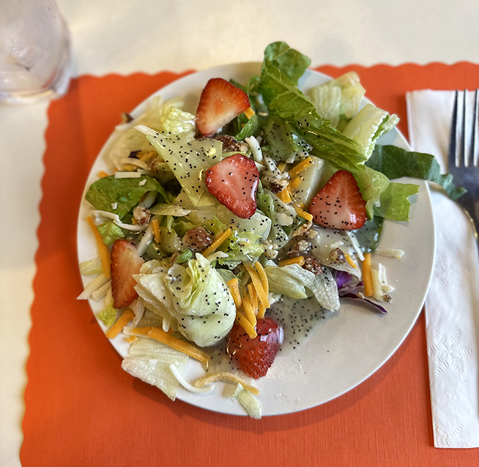 A symphony of fresh greens, strawberries, and cheese that somehow makes you feel virtuous while dining at pie headquarters.