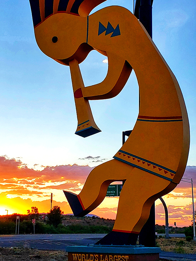 Sunset transforms our golden friend into a fiery silhouette, proving even roadside attractions have their magic hour.