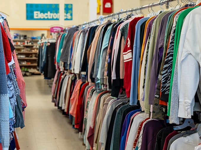 The clothing aisles stretch toward infinity, a rainbow of fabrics where that perfect sweater is hiding somewhere between practical and peculiar.