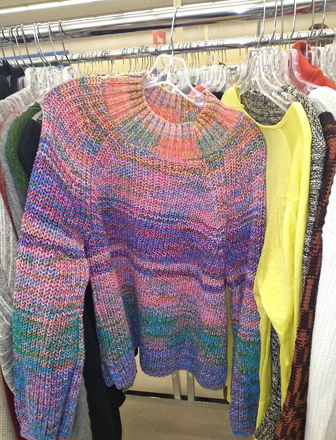 That rainbow-hued sweater screams "1980s craft fair champion." Pair it with confidence and you've got yourself a statement piece.