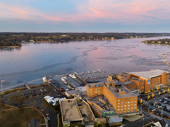 Winter transforms the Navesink into a serene, ice-flecked landscape, where marina docks stand ready for the spring thaw and boating season ahead.
