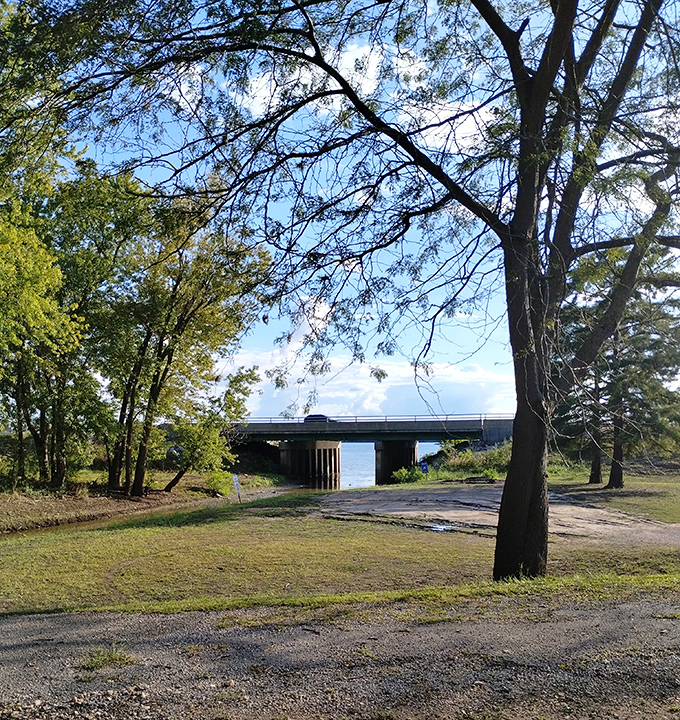 The Mississippi River peeks through the trees, a reminder that this mighty waterway has shaped Elsah's story for generations. 