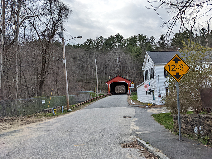 The view approaching the bridge feels like discovering a secret portal to 19th-century New England.
