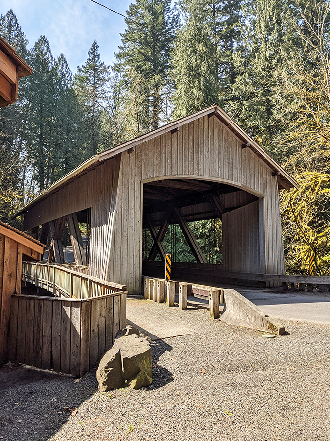 The bridge's simple silhouette against summer greenery proves that sometimes the most memorable landmarks aren't the tallest or flashiest.