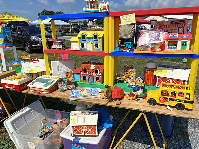 Childhood memories arranged on folding tables. These Fisher-Price toys survived decades of playtime to find themselves here, waiting for round two.