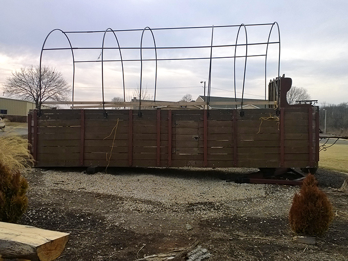 Behind-the-scenes of a record holder. Without its canvas covering, the wagon reveals the impressive wooden framework that supports this roadside colossus.