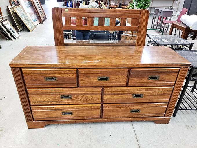This solid wood dresser has probably seen more bedroom secrets than a marriage counselor, yet stands ready for more.