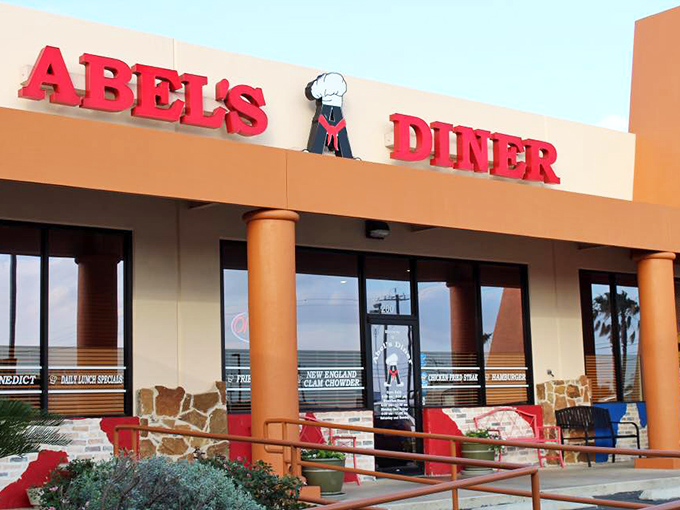 Abel's Diner's bright red sign and chef logo make a bold promise. Inside, chicken fried steak and New England clam chowder create the most delicious Texas identity crisis.
