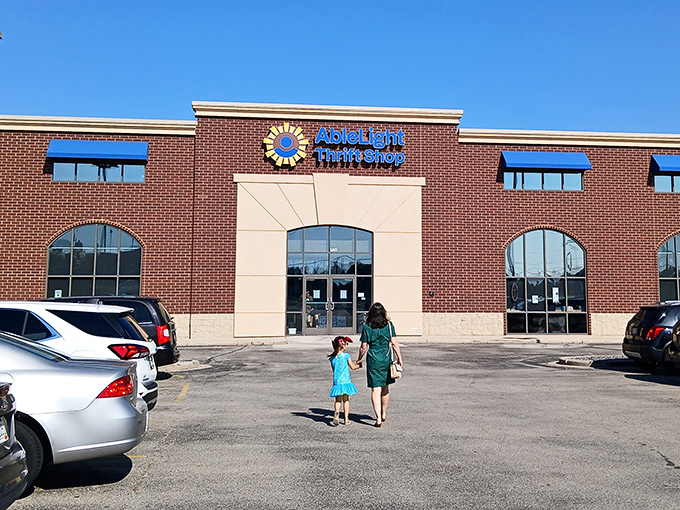 AbleLight's brick facade and sunny logo hint at the bright shopping experience waiting inside. Thrifting with a mission.