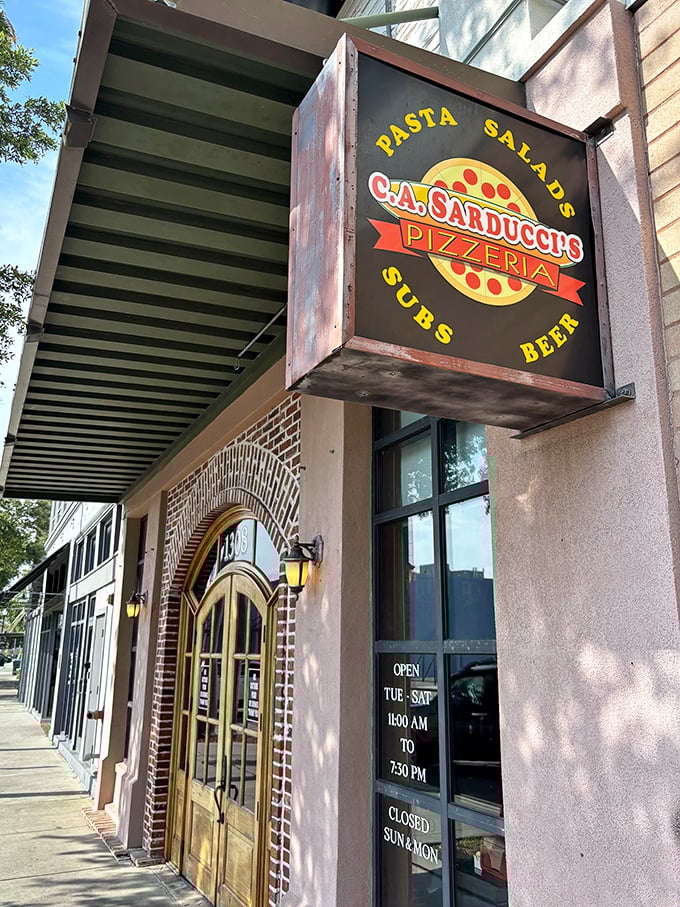 C.A. Sarducci's rustic sign promises authentic Italian flavors. That brick archway entrance is like a portal to pizza paradise!