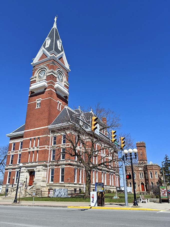Victorian clock tower standing sentinel over a main street that time forgot to rush.