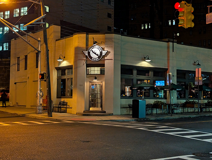 Nighttime transforms this corner spot into a hot dog speakeasy. Urban cool meets comfort food in the best possible way.