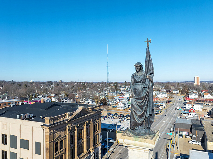 A statue reaches skyward in Freeport, where historic architecture and small-town charm come without big-city price tags.