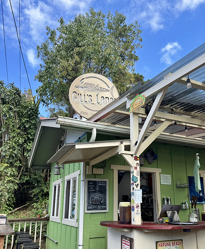 Lime green building, circular fish sign&mdash;Gill's tropical hideaway looks like where Jimmy Buffett would go for his seafood fix!