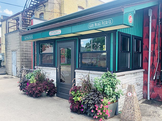 Glass Nickel's charming green storefront blooms with flower boxes. Eco-friendly pizza never looked so inviting!