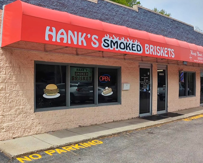 That bold red awning signals serious brisket business. Small building, enormous flavors waiting inside.