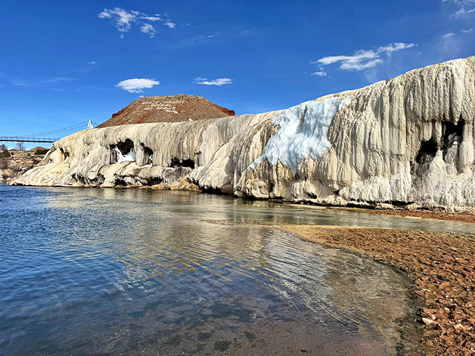 Natural hot spring terraces cascade like frozen waterfalls, creating Wyoming's most relaxing geological wonder attraction.