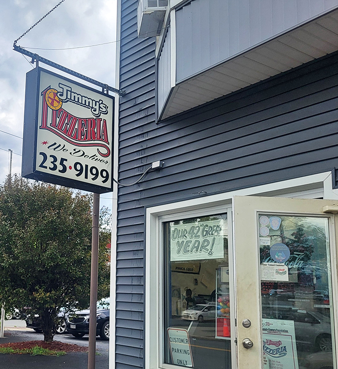 Jimmy's Pizzeria: That unassuming sign has been guiding hungry travelers to pizza nirvana longer than most GPS systems.