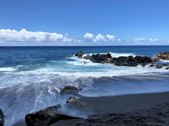 Kehena's inky black sand creates a striking canvas for the Pacific's blue waves. A beach born from destruction that became something beautiful&mdash;nature's ultimate recycling project.