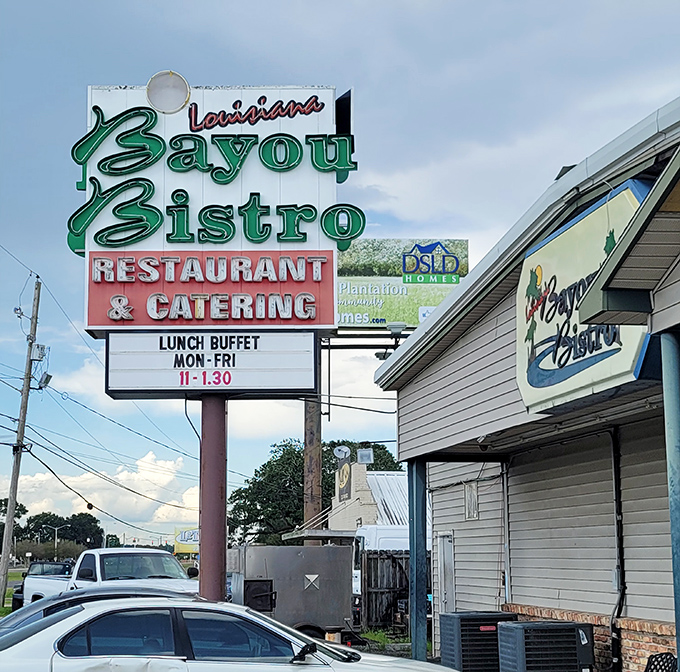 Louisiana Bayou Bistro's sign stands tall, beckoning hungry travelers with promises of Cajun delights.