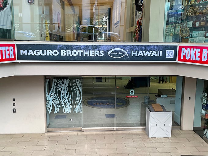 Maguro Brothers' sleek glass entrance offers a window into poke perfection &ndash; where Japanese precision meets Hawaiian tradition.