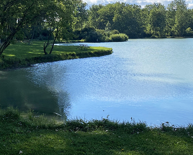Peaceful inland lake with nature's perfect landscaping. Maumee Bay's waters offer a mirror for clouds playing hide-and-seek.