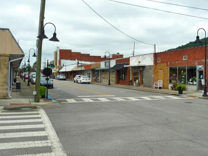 Oneonta's brick buildings wear their age beautifully, standing shoulder to shoulder like they're protecting the town square's precious secrets.
