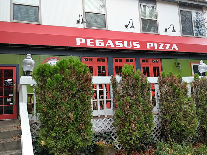 Pegasus Pizza's bright red awning signals that mythically good slices await inside this Eugene neighborhood favorite.