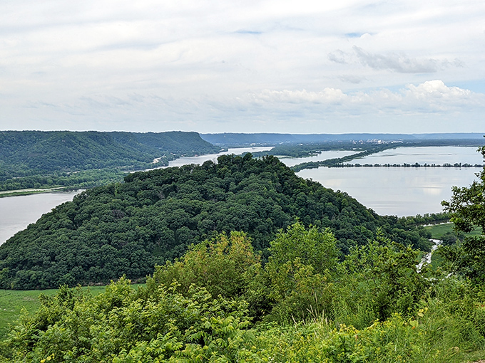 Nature's perfect triangle: Perrot State Park's iconic bluff view where the Mississippi and Trempealeau rivers meet in misty harmony.