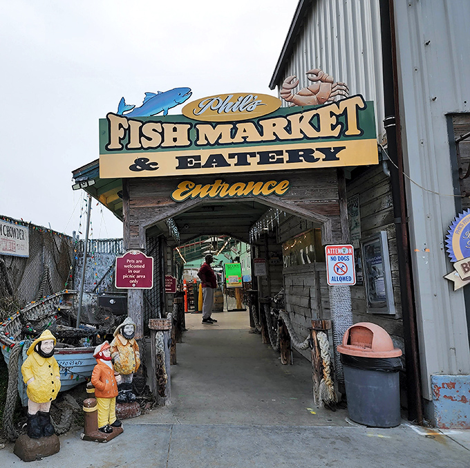 Phil's Fish Market's weathered entrance tells stories of countless seafood feasts. Those fishermen statues have seen things, man.