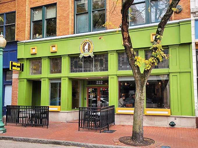 The vibrant green facade of Pies & Pints brightens Capitol Street, promising creative pizza combinations that defy expectations.