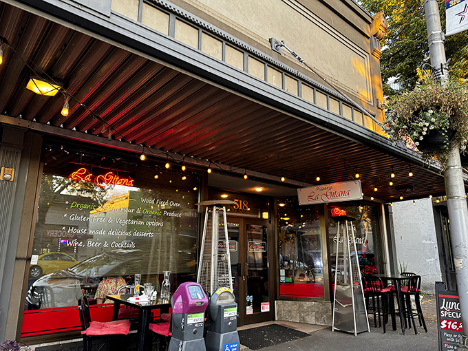 La Gitana&rsquo;s inviting warmth shines through glass windows. Olympia&rsquo;s little corner of European pizza elegance awaits inside.