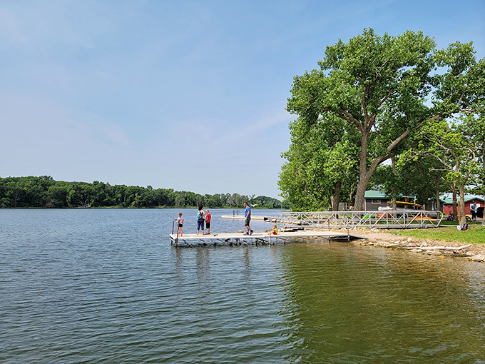 A fishing dock extending into calm waters, where patience isn't just a virtue&mdash;it's the difference between dinner and a good story.