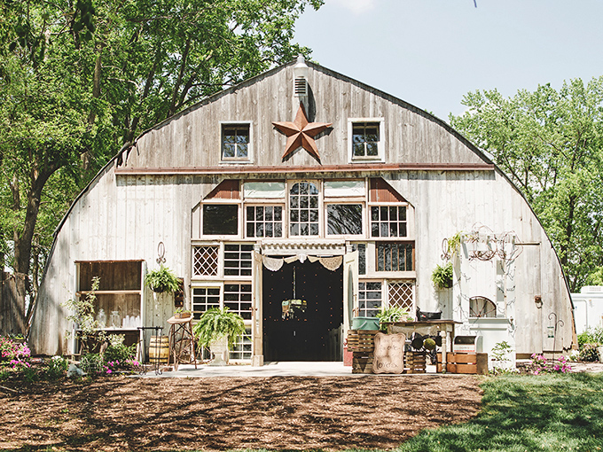 Not your average barn! This architectural wonder houses vintage treasures in a setting straight from a decorator's dream.