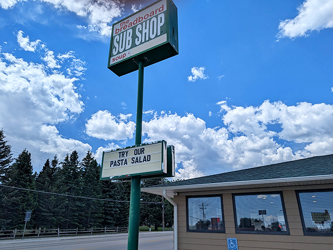 The Breadboard's towering sign against Wyoming's endless sky&mdash;a landmark for sandwich pilgrims in the know.