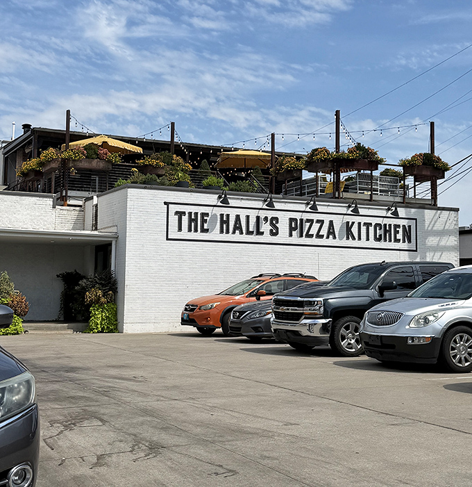The Hall's rooftop garden isn't just pretty—it's the perfect perch for devouring wood-fired masterpieces under Oklahoma skies.