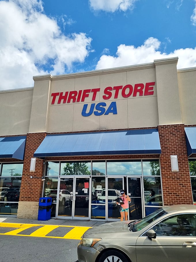 Red, white, and blue bargains! Thrift Store USA welcomes shoppers with patriotic signage and blue awnings that pop against the summer sky.